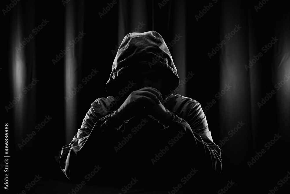 Hackers wear hoods to cover their faces. Hacking to steal important ...