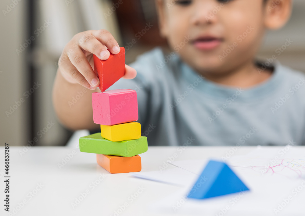 Close up Children hand Practice the skills of playing with wooden toys ...