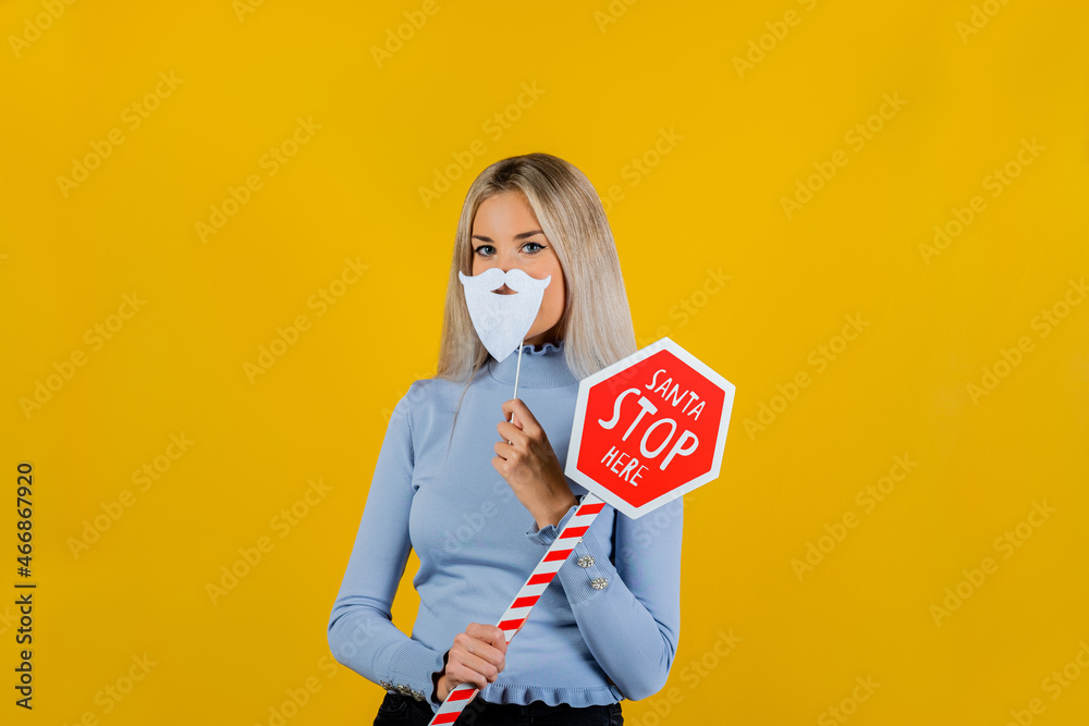 Beautiful girl celebrating and having fun at a party with photo props ...