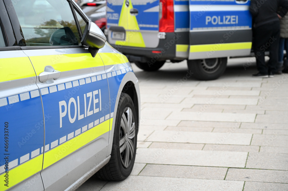 German police cars on the street. Side view of a police car with the ...
