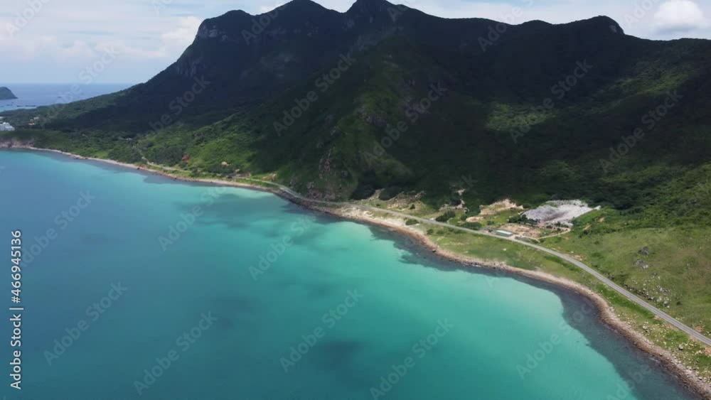 Establishing shot of the huge landfill located on a tropical island. A ...