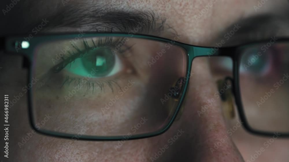 Timelapse shot, close-up of a woman's eye looking at a computer screen ...