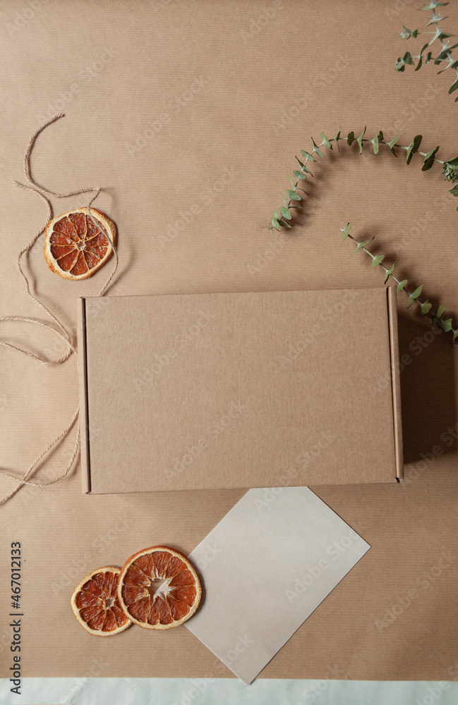Overhead view of a package ready to wrap in brown paper with a blank ...
