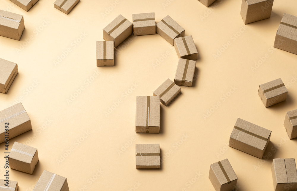 Question mark made from cardboard boxes on a brown background. Stock ...