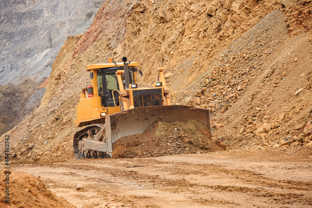 Bulldozer workflow for laying or leveling a technological road in a ...