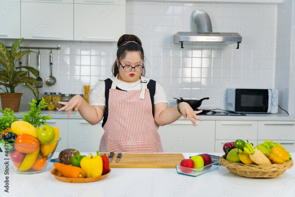 Down syndrome girl, cooking, smiling, concept is mental health ...