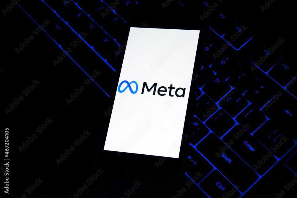 Facebook changed its name to Meta. Smartphone with Meta logo on blue ...