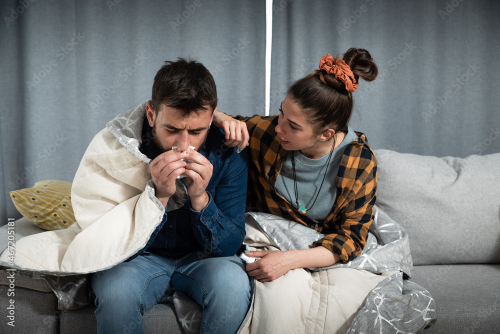 Sick man and woman have common cold, flu and high fever. Ill young ...