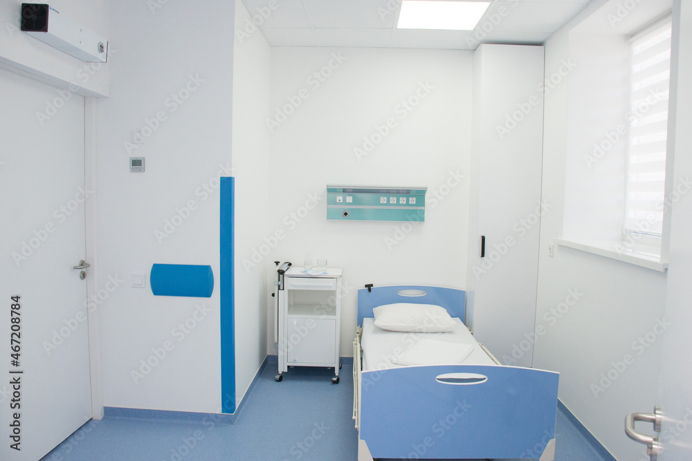 Empty modern hospital room with oxygen concentrator. Modern medical ...