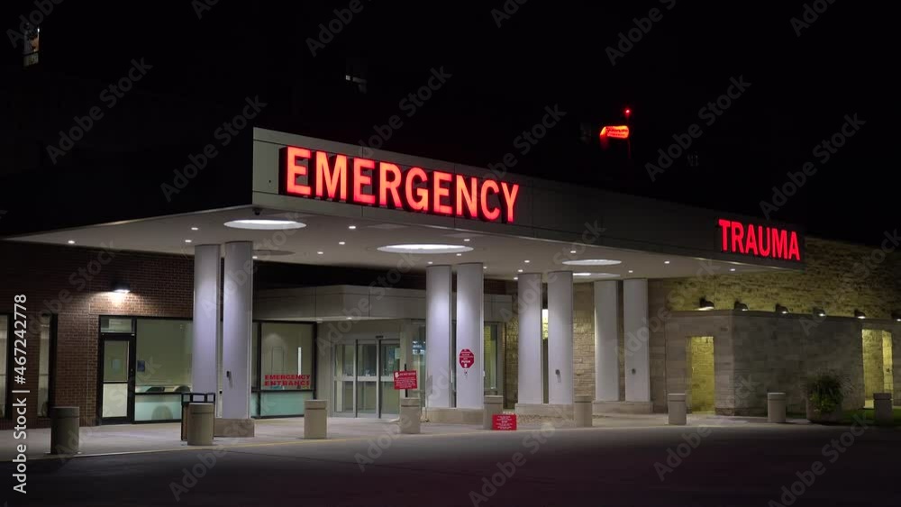 Good night establishing shot of a generic modern hospital with ...