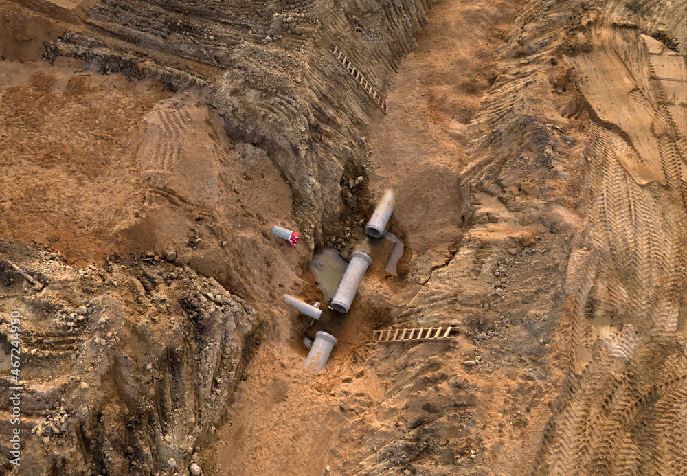 Laying of underground storm sewer pipes and sewerage wells ...