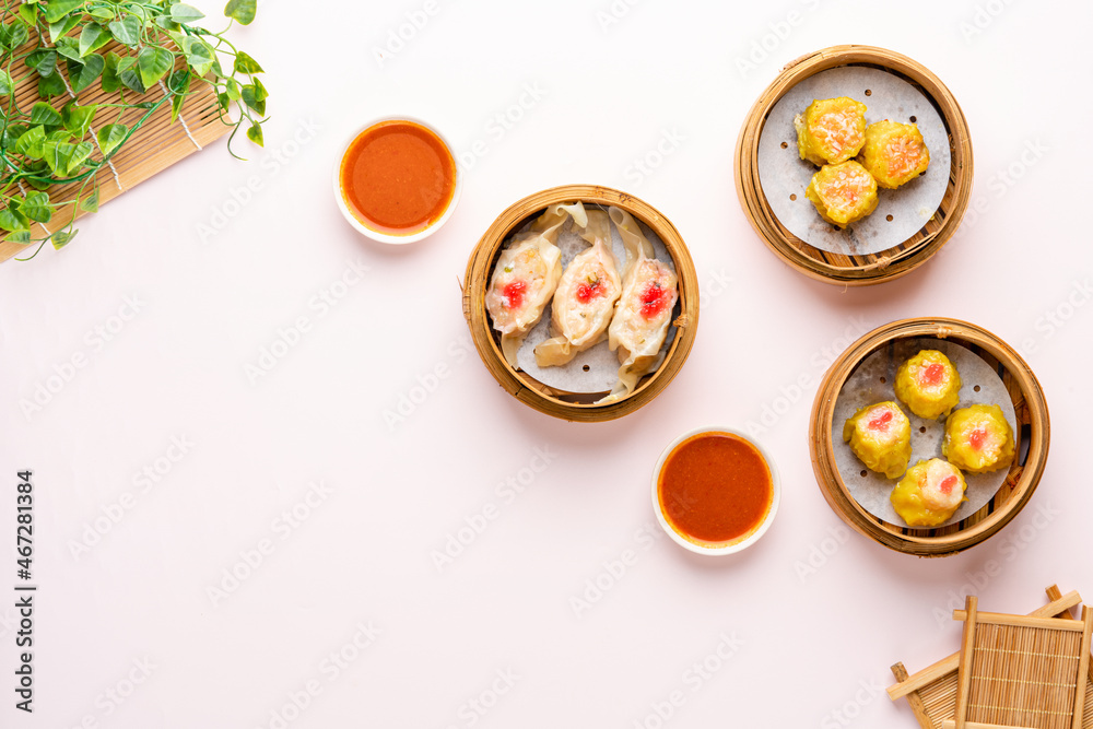 Top View of Assorted Chinese Dimsum in bamboo basket. Dimsum is a large ...