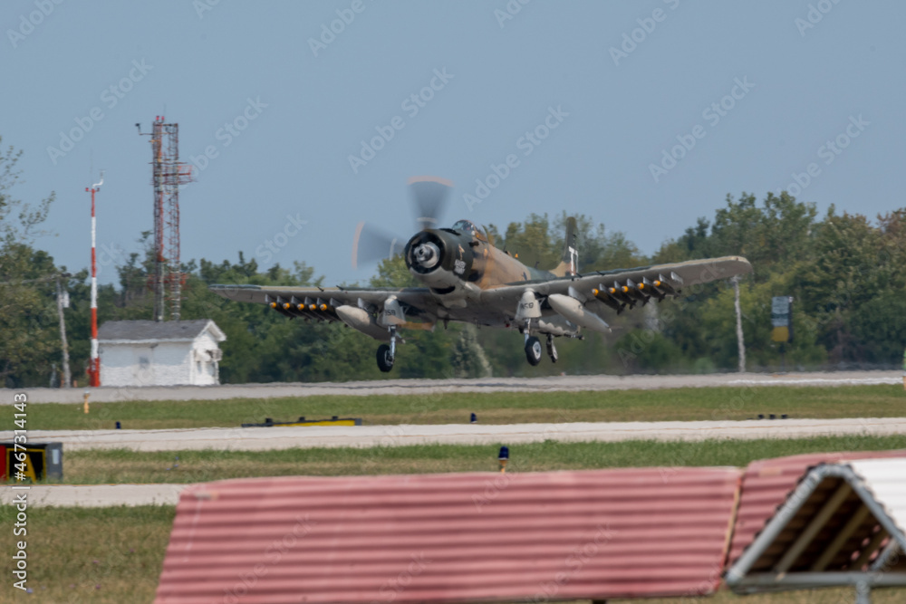 Vintage military aircraft taking off in an airbase Stock Photo | Adobe ...