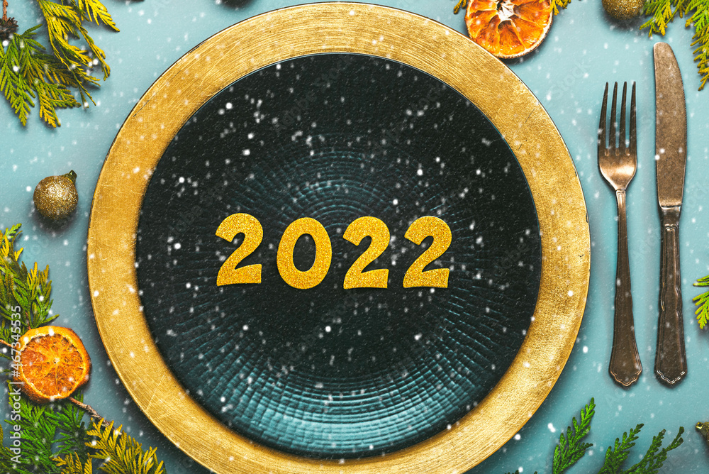 Happy new year 2022. Top view of golden Numbers 2022 on plate for ...