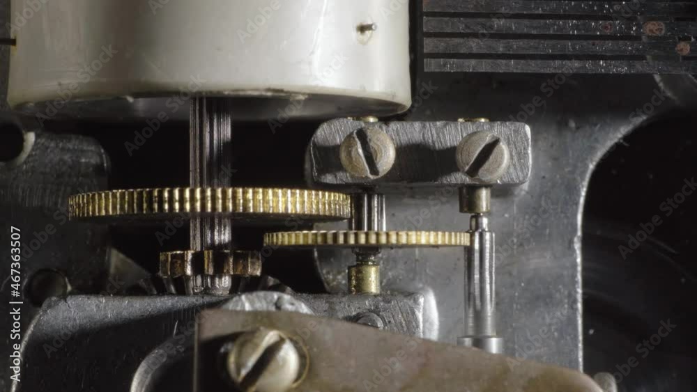 Internal working mechanism of an old vintage music box. Rotating gears ...