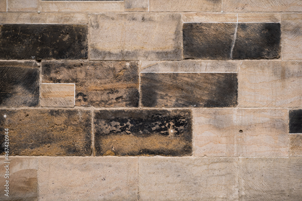 Massive stone wall made of sandstone blocks. Building exterior of an ...