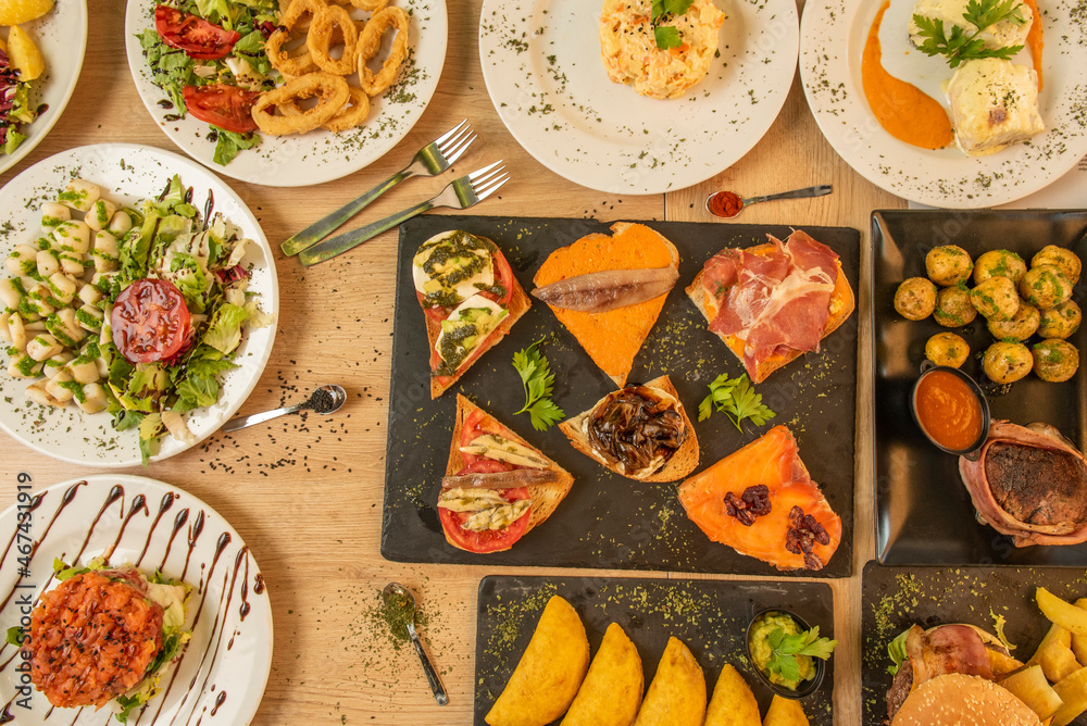 Latin cuisine and fusion dishes set. Wakame salad with smoked salmon ...