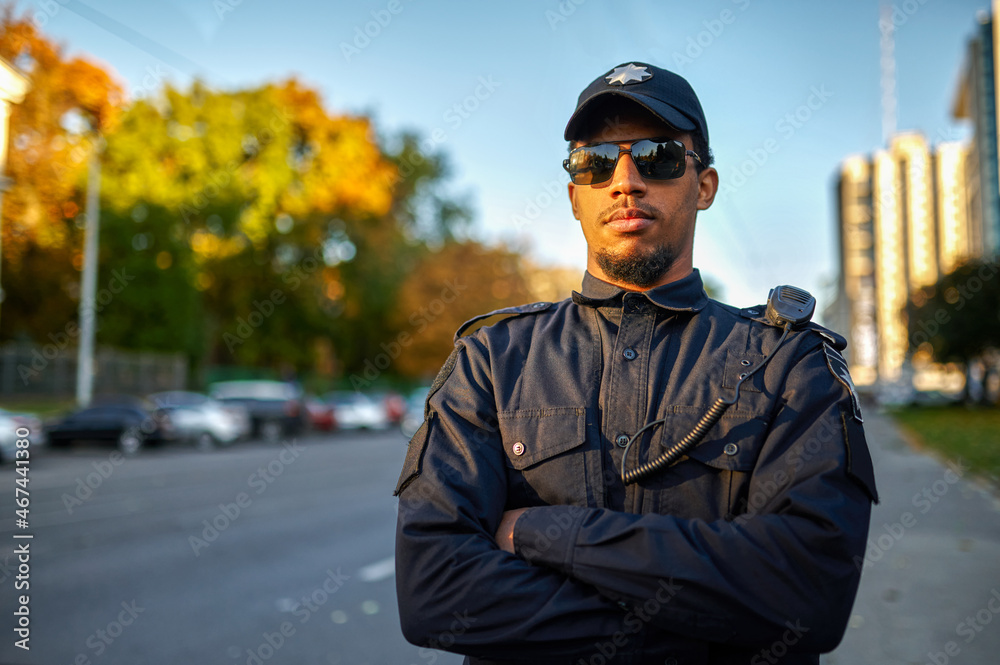 Police officer in uniform and sunglasses outdoors Stock Photo | Adobe Stock