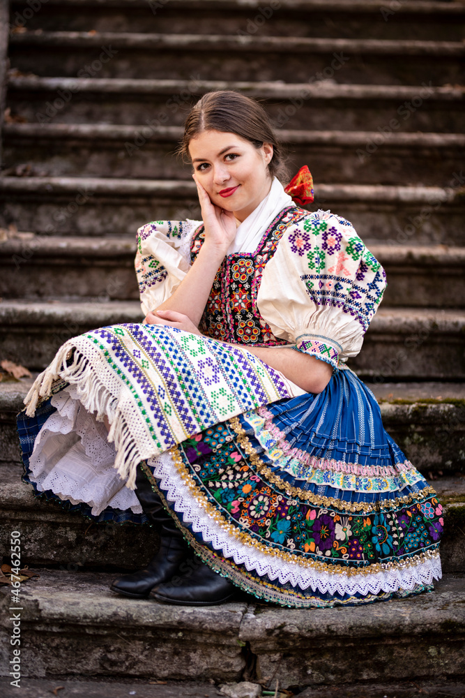 Young beautiful slovak woman in traditional dress. Slovak folklore ...