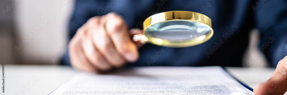 Auditor Using Magnifying Glass For Audit Stock Photo | Adobe Stock