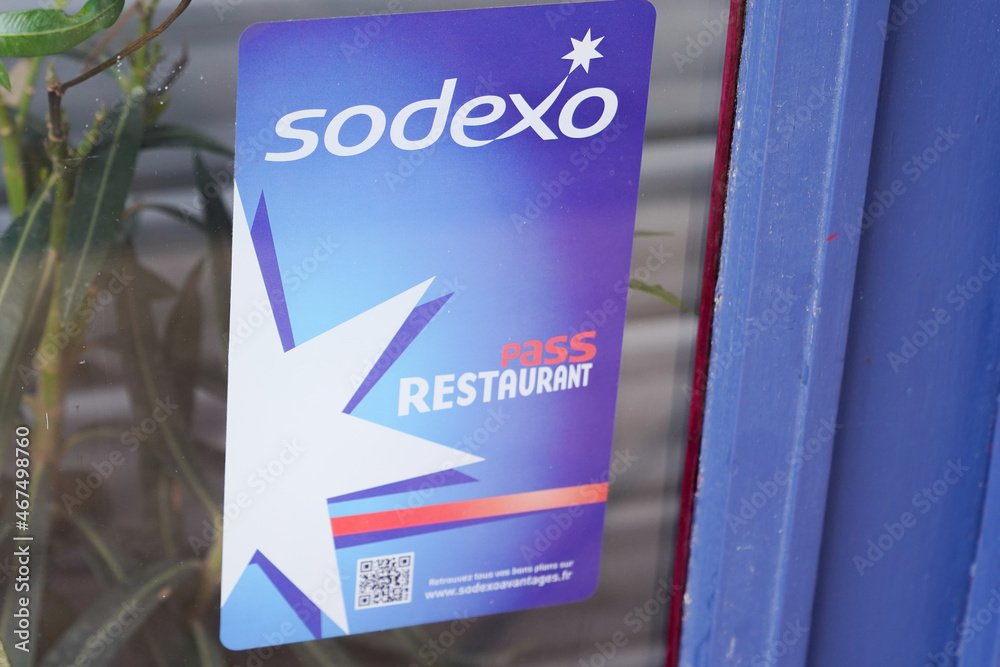 Sodexo brand logo and text sign front of pub bar door window restaurant ...