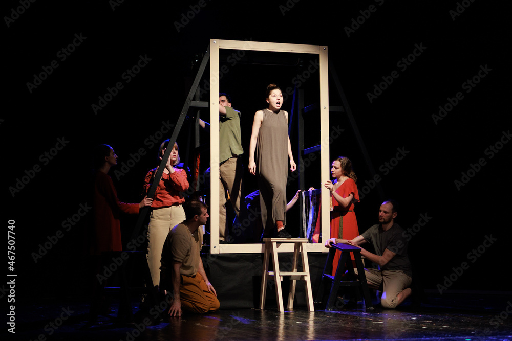 Actors and actresses perform a modern performance on the stage of the ...