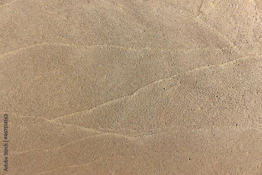 Light brown beach sand texture with crossing line pattern from where ...