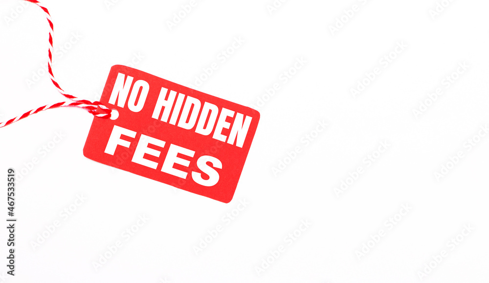 The inscription NO HIDDEN FEES on a red price tag on a light background ...