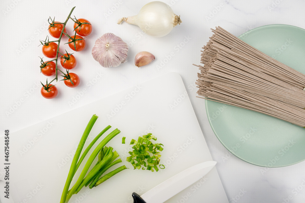 The process of cooking soba - buckwheat Japanese noodles. On a cutting ...