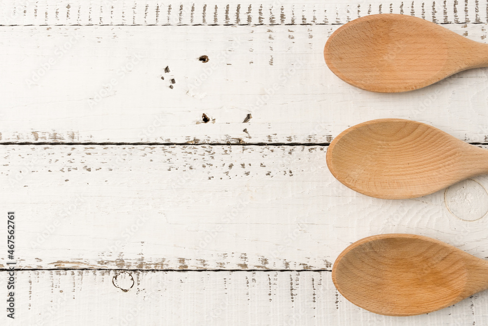 Trendy kitchen wooden spoons. Minimal trendy banner with three wooden ...