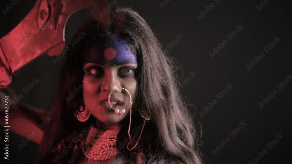Angry Indian Goddess Kali looks at someone and about to attack with ...