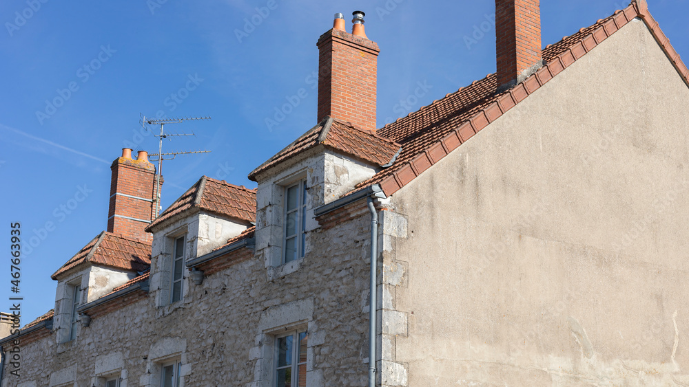 Roof top chimneys and attic windows of a French house Stock Photo ...