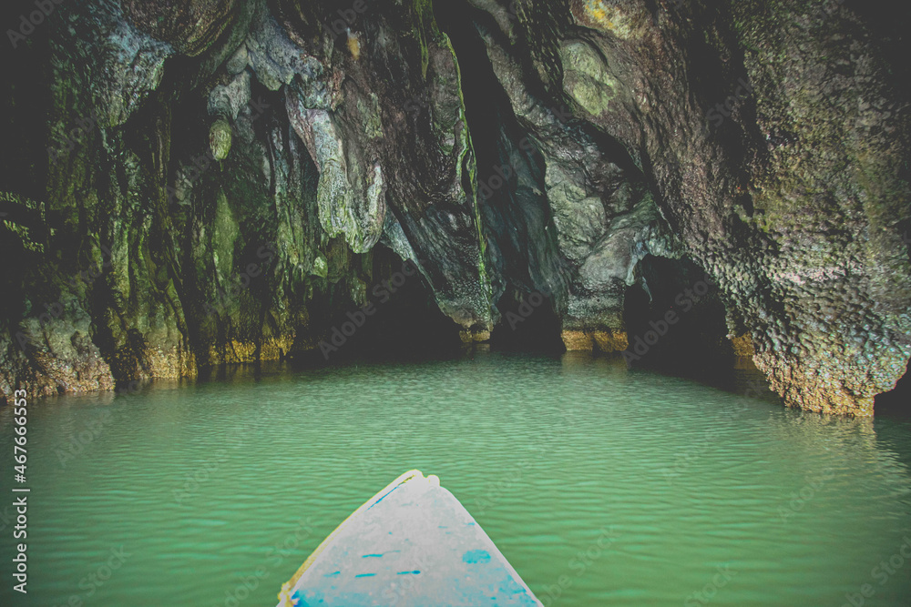 Kayaking through underground cave system with bats and stallegtites ...