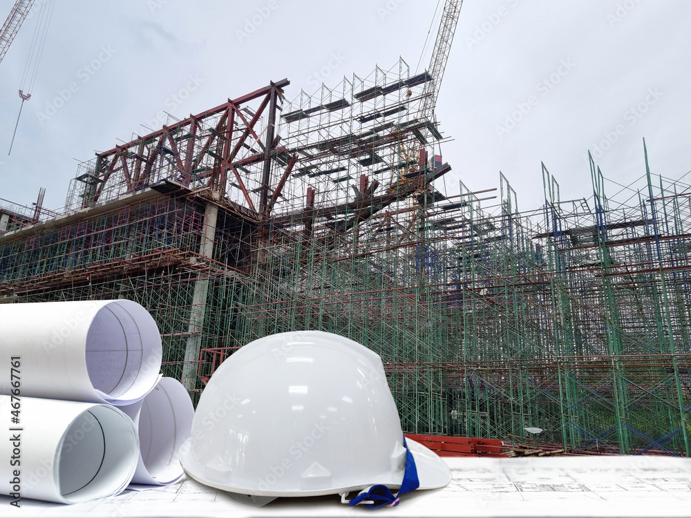 Construction industry caps and building construction drawings Stock ...