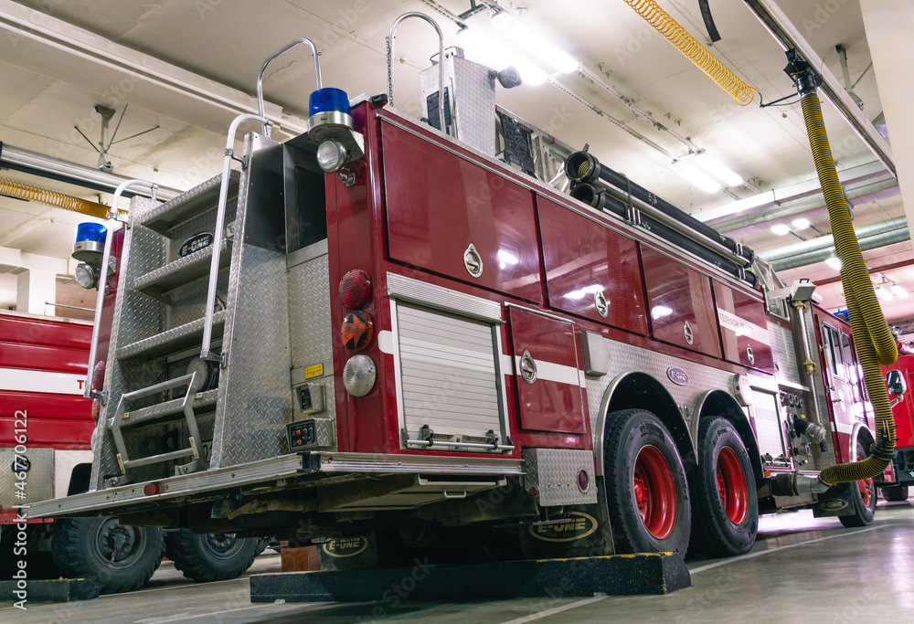 Fire station. A fire truck for delivering firefighters to the fire site ...