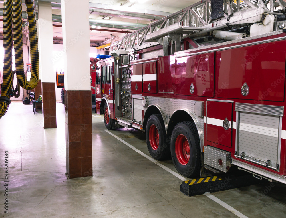 Fire station. A fire truck for delivering firefighters to the fire site ...