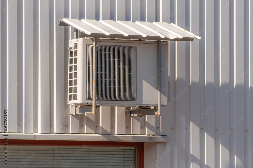 External air conditioning unit on the facade of the building under a ...