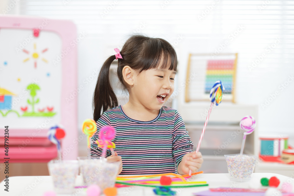 young girl making craft for homeschooling Stock Photo | Adobe Stock