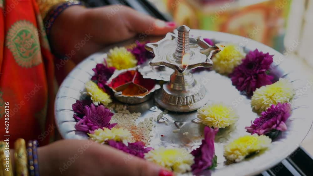 women doing tulsi water offering and flowers poojan Diwali festival ...