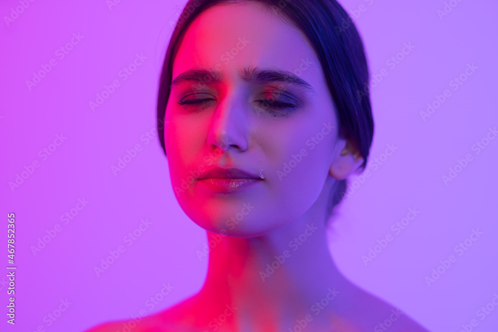 Spoiled makeup with tears. Tears on the cheek of a young girl. Crying ...