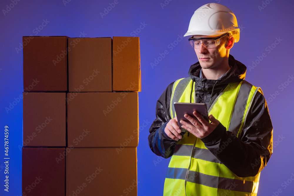 man is engaged in warehouse logistics. Logistics center employee. Man ...