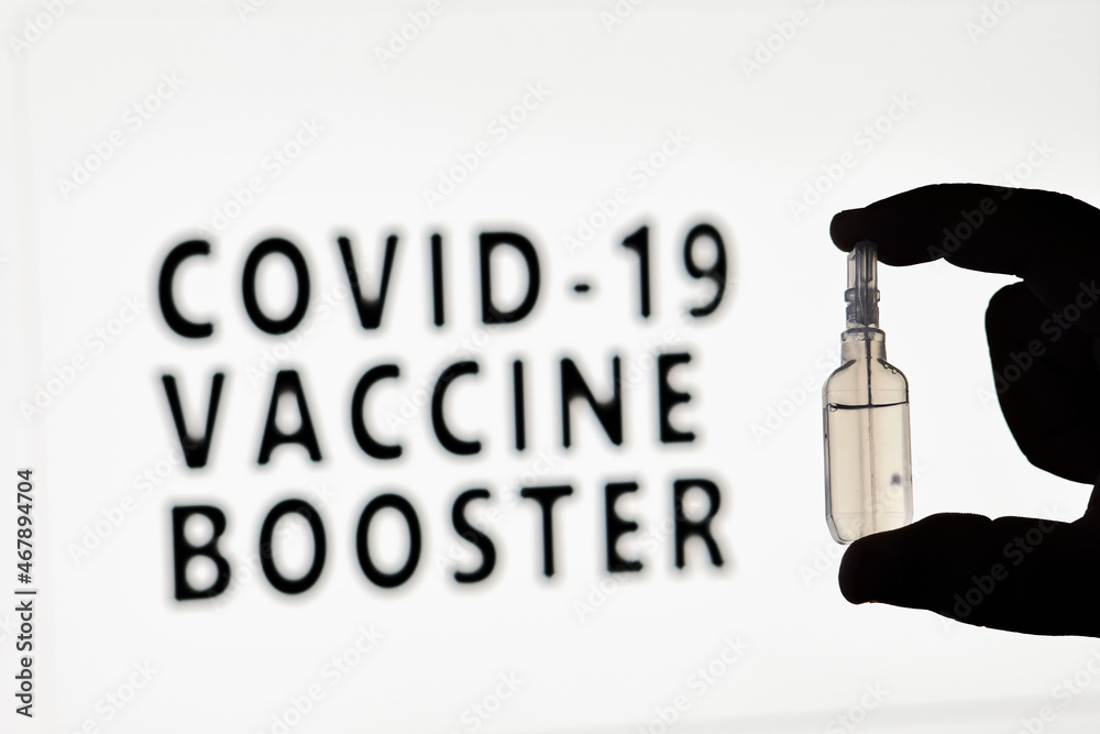 Covid-19 Vaccine booster dose. Hand of the doctor holds a new Covid ...