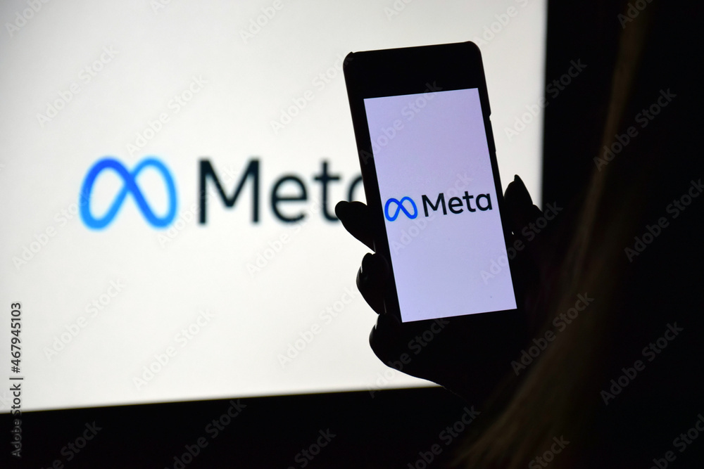 Smartphone with Meta logo on the background on logos of products owned ...