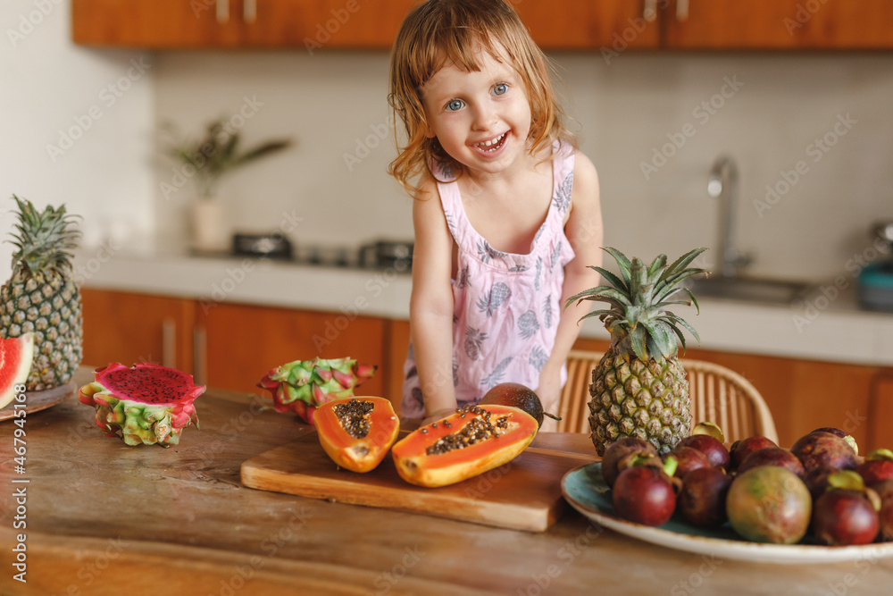 Child healthy food and balanced nutrition. Fruit breakfast. Smiling ...