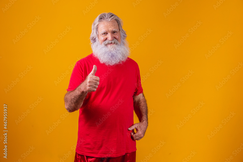 Old man with a long beard on a yellow background. Thumb up. Senior with ...