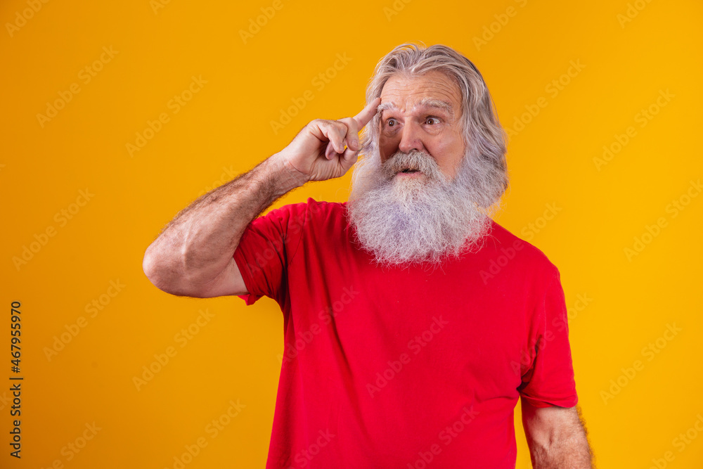 old man with long beard with fingers on the side of his forehead ...