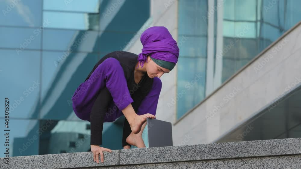 Young strong business woman islamic muslim student stands in balance ...