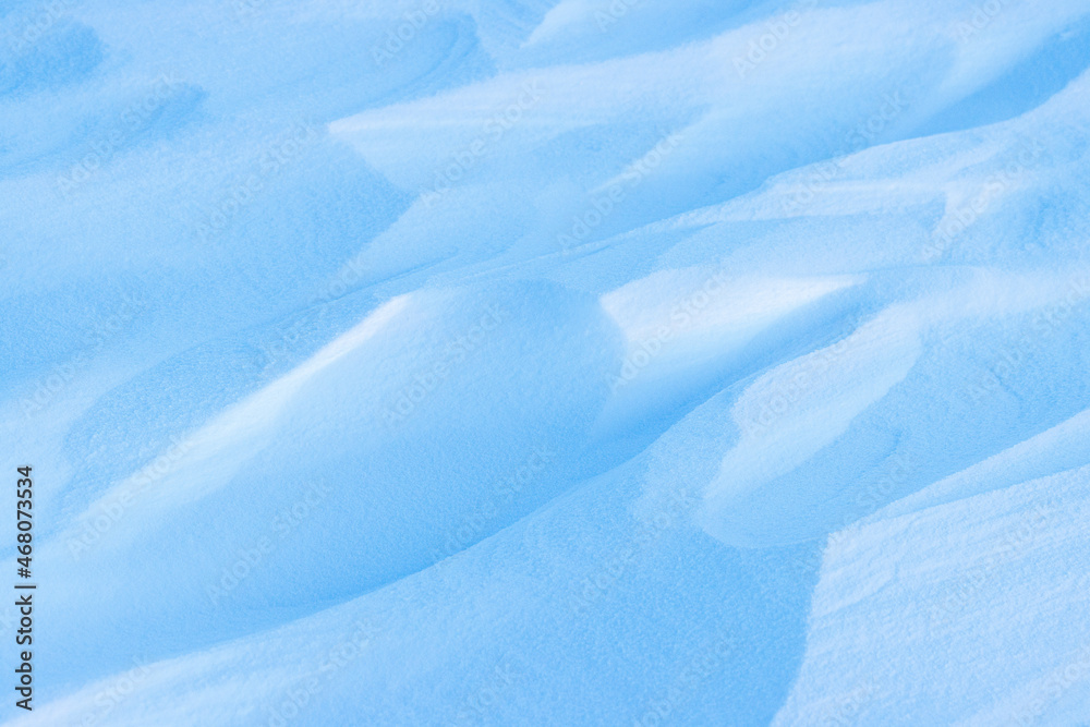 Snow texture. Wind sculpted patterns on snow surface. Wind in the ...