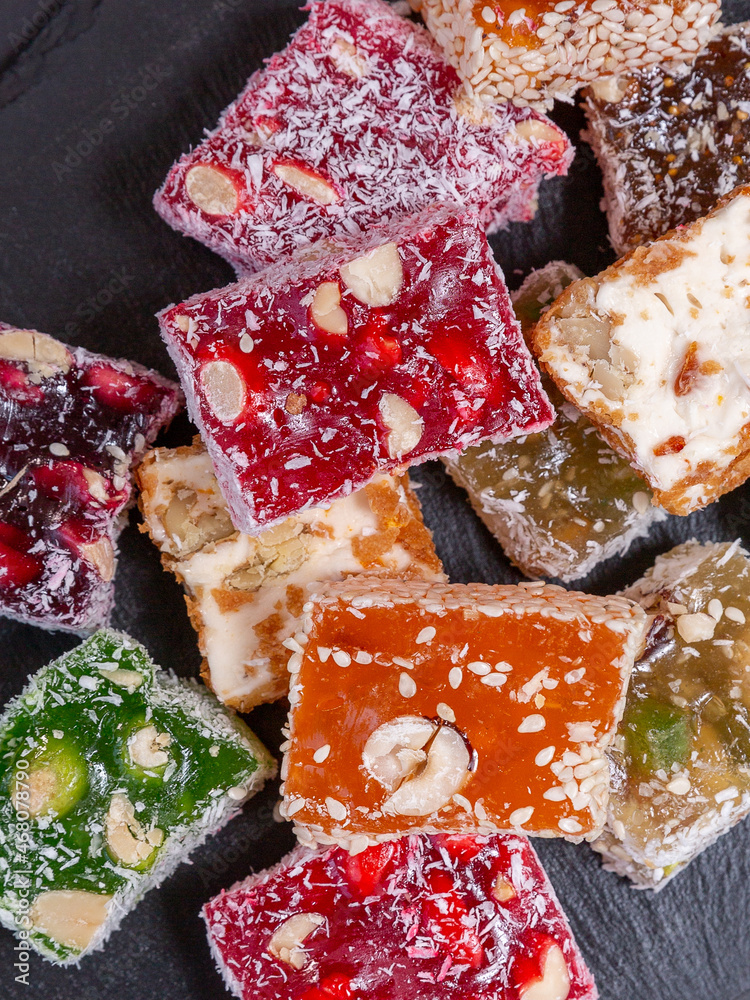 Lukum, a set of Arabic sweets, a national Turkish dessert on a black ...