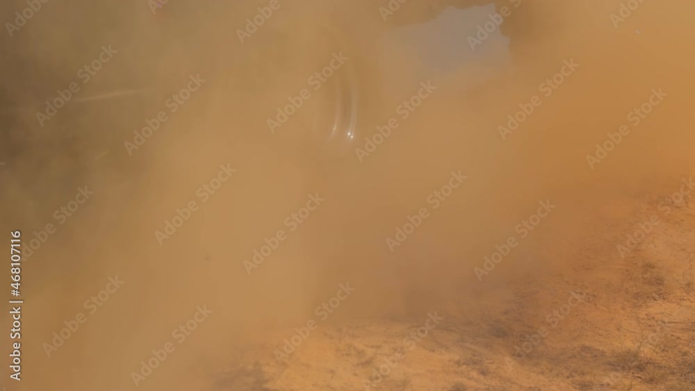Slow Motion Close Up: Suv driving on sandy road, covered in dust, side ...